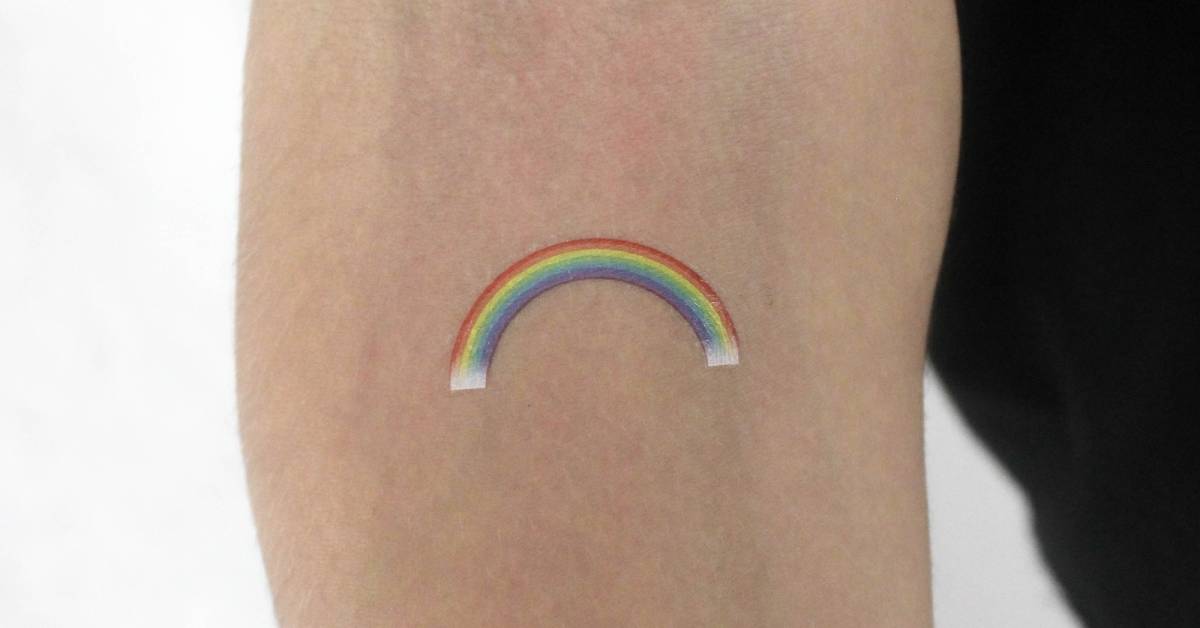 Color rainbow temporary tattoo placed on the inner