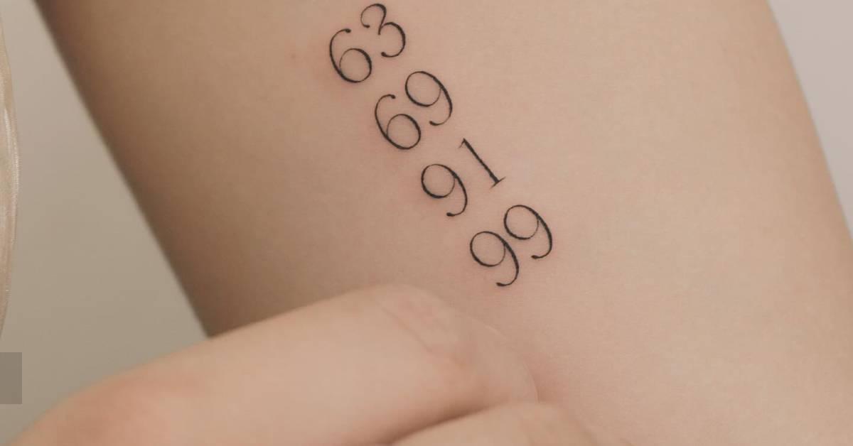Numbers tattoo in serif font located on the inner arm.