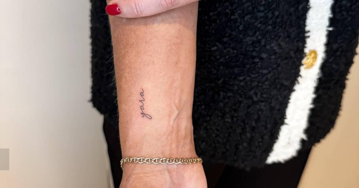 Handwritten lettering tattoo of the name "Yara" located