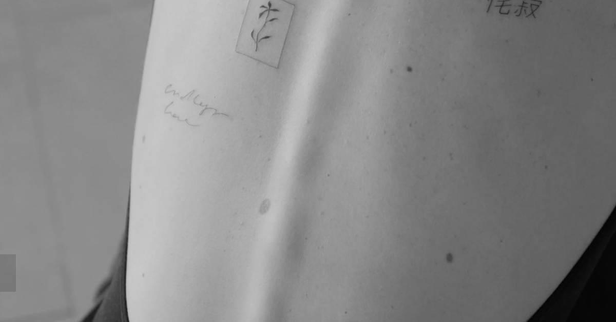 Back composition tattoos in fine line style.