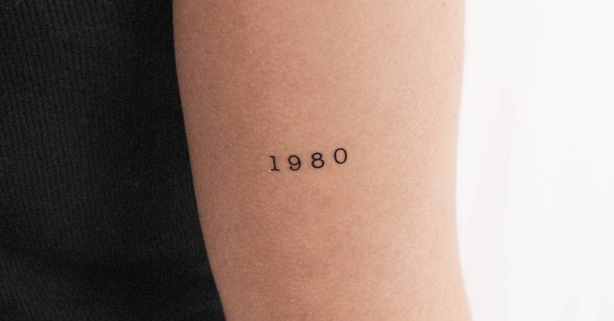 "1980" birth year temporary tattoo located on the