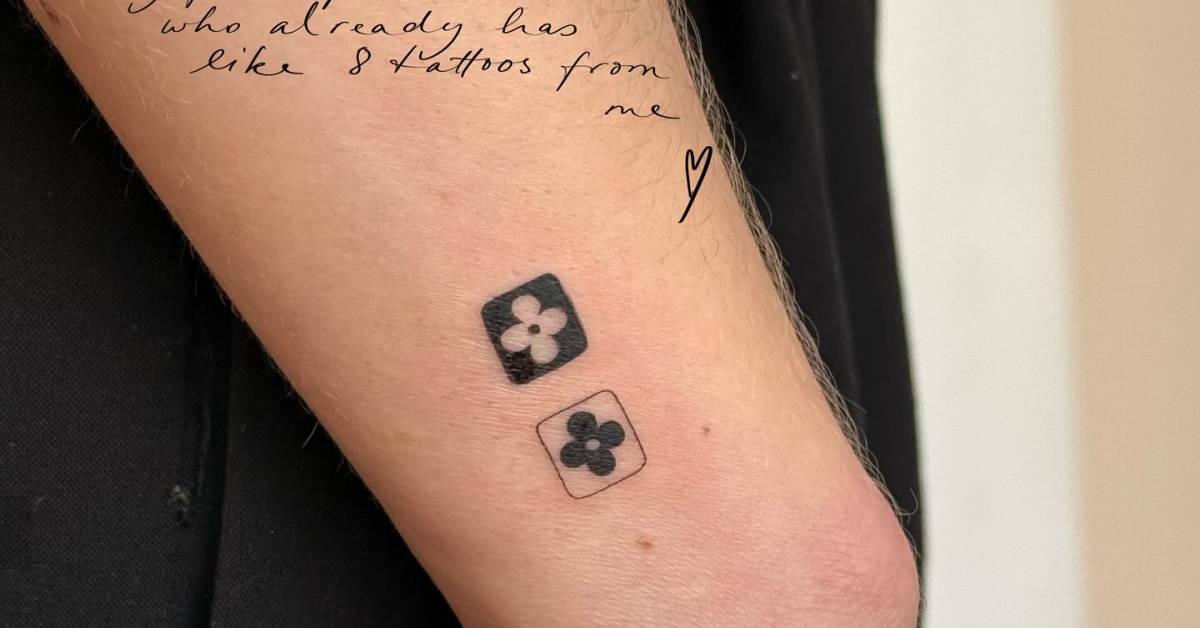 Flower tiles tattoo in minimalistic style located on