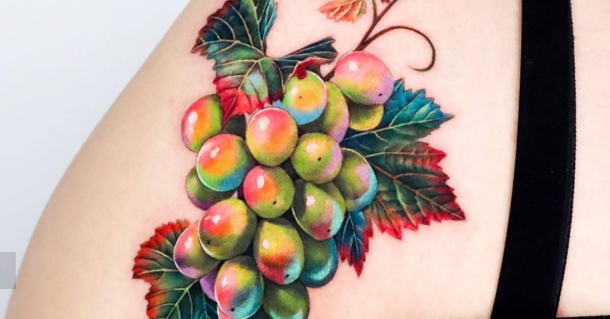 Grapes tattoo in realism located on the shoulder.