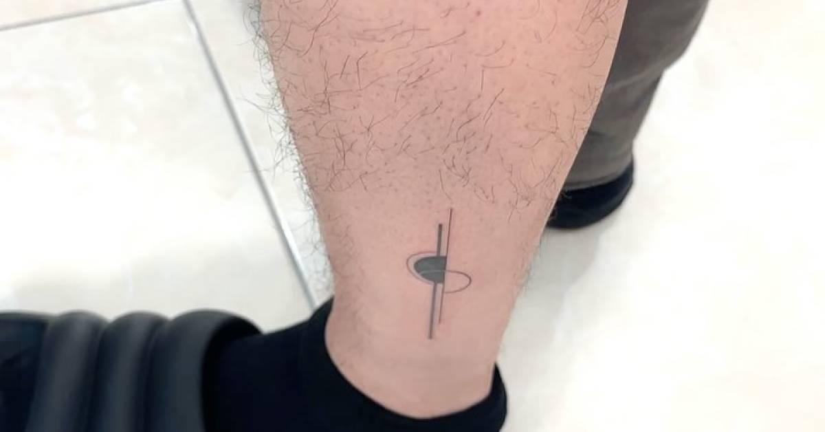 Abstract geometric tattoo located on the ankle.