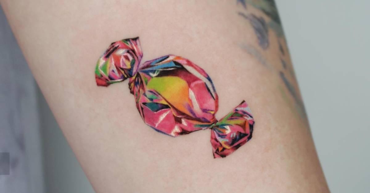 Realistic style candy tattoo placed on the inner