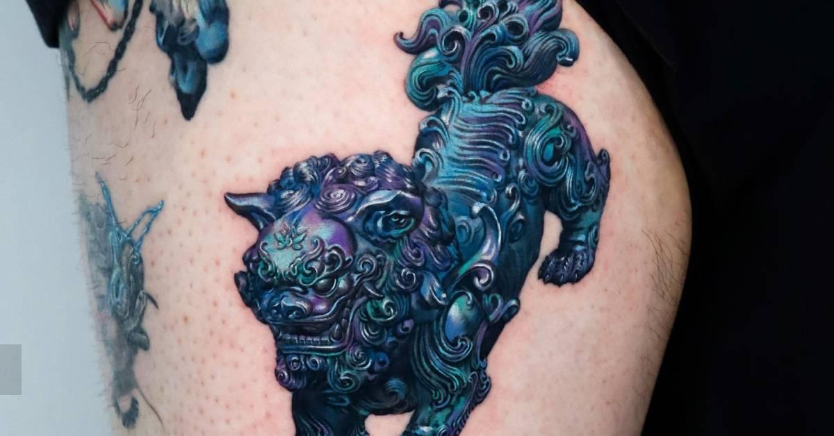 Haetae tattoo located on the thigh, realistic style.