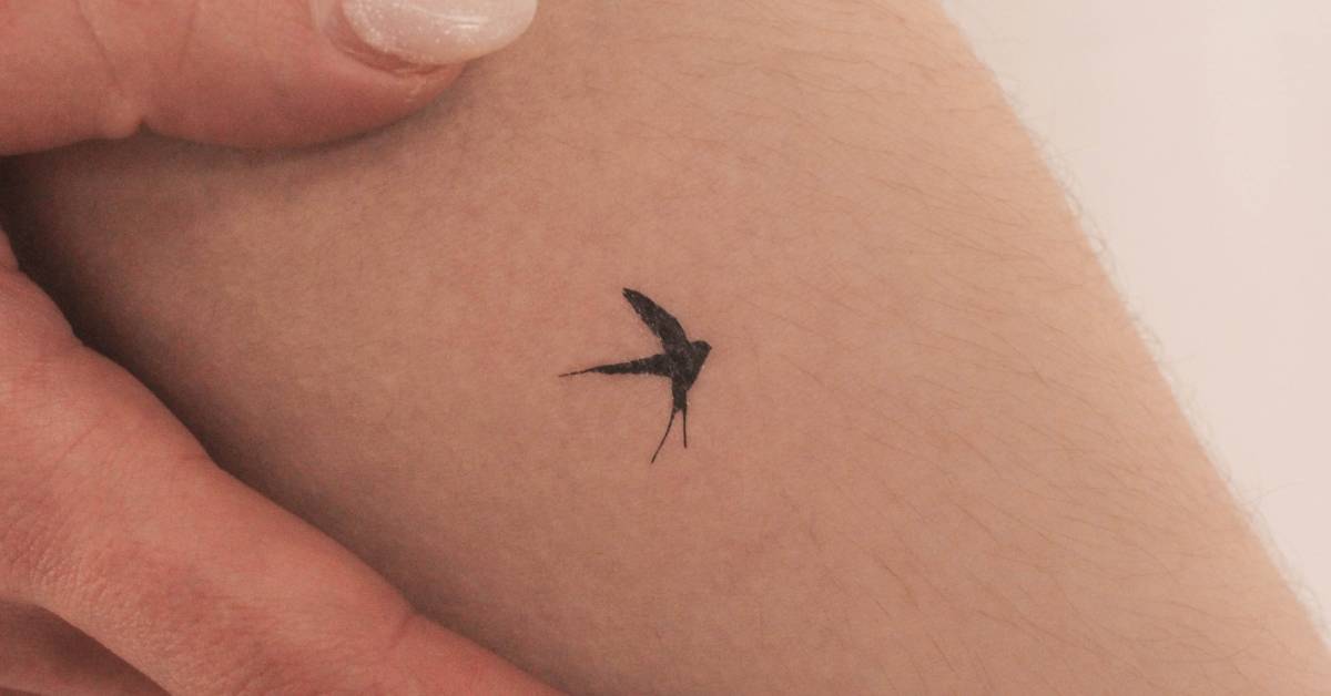 Small minimalistic swallow temporary tattoo done on the
