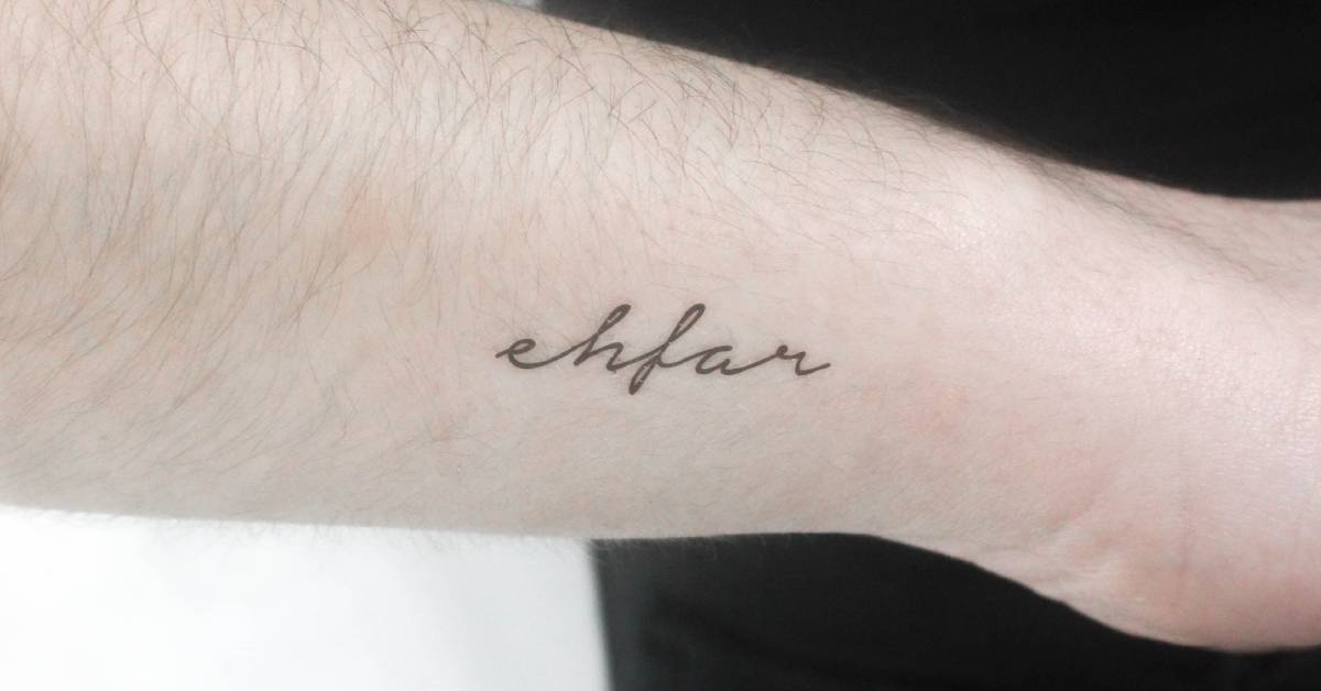 Handwritten "Ehfar" temporary tattoo placed on the