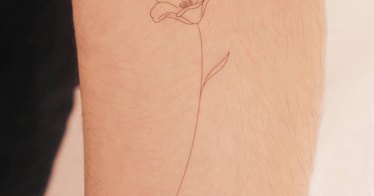 Fine line style poppy flower by Jakenowicz temporary