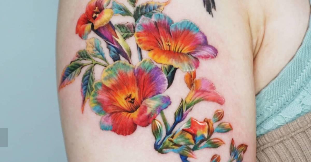Realistic style trumpet creeper tattoo located on the