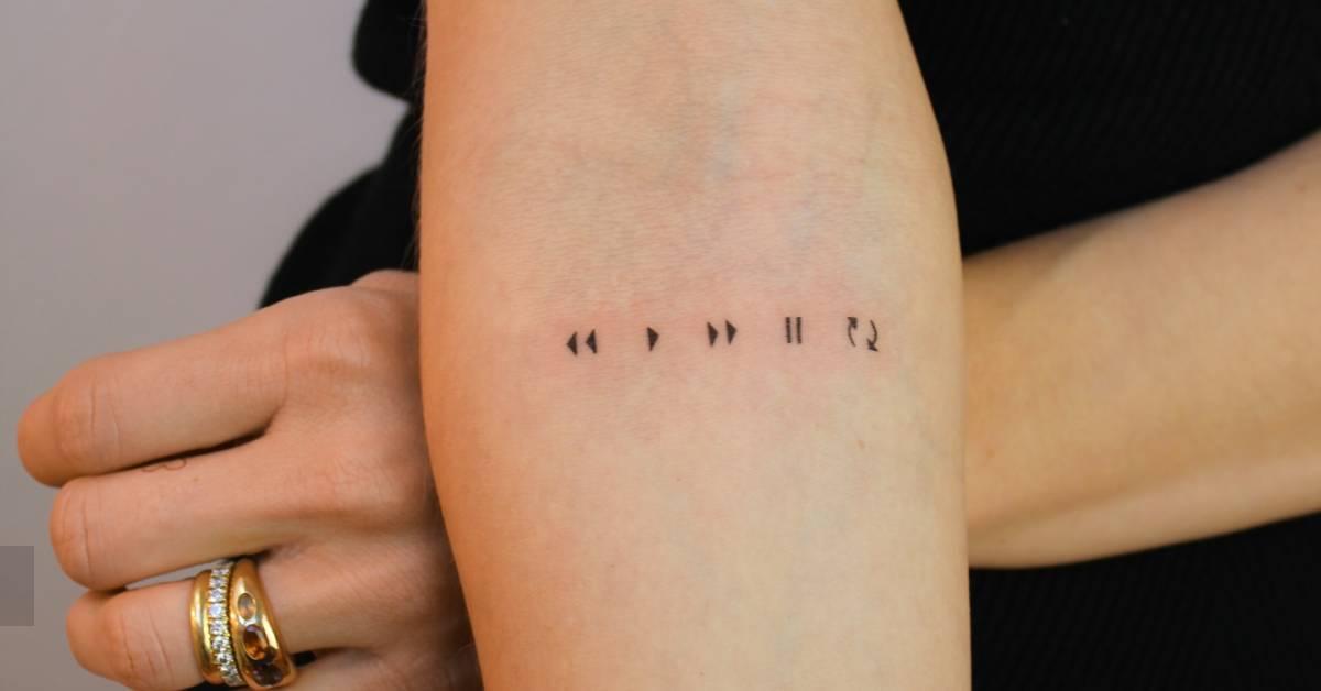 Music media controls tattoo in minimalistic style