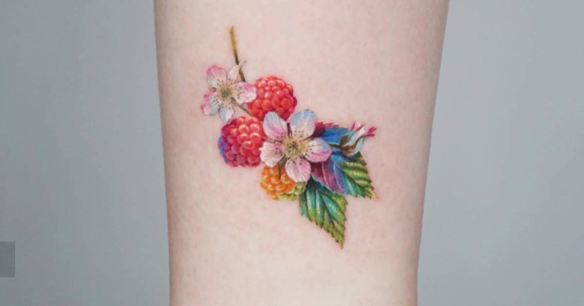 Raspberries tattoo in realistic style done on the