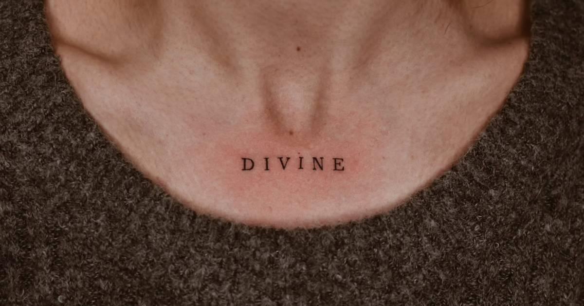 Lettering tattoo that says "divine" located on the