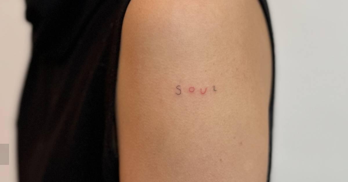Handwritten lettering tattoo of the word "soul" located