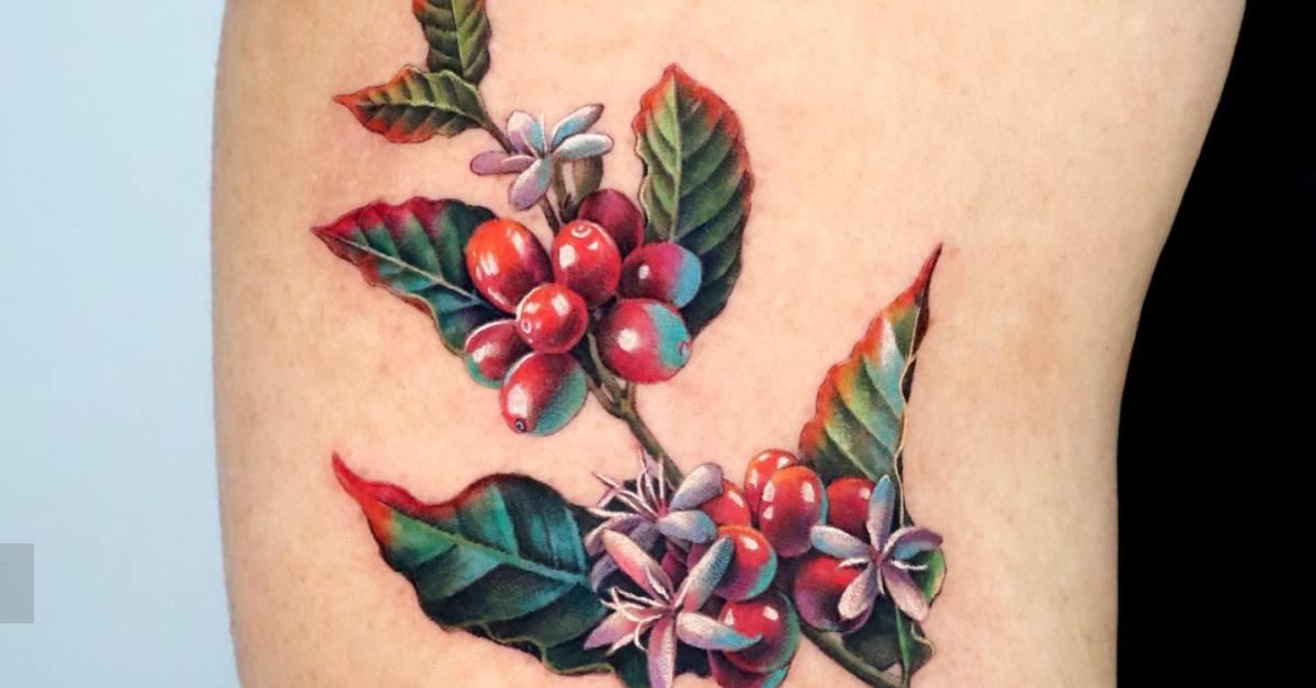 Realistic style coffea tattoo located on the upper arm.