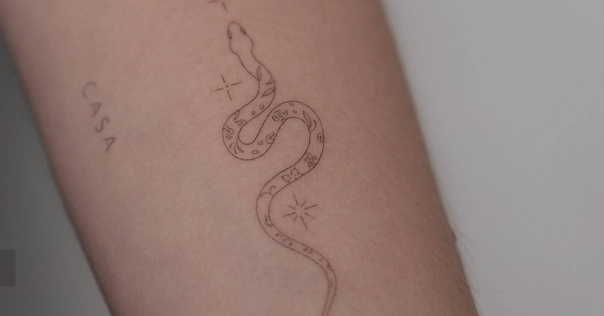 Single needle snake tattoo located on the inner