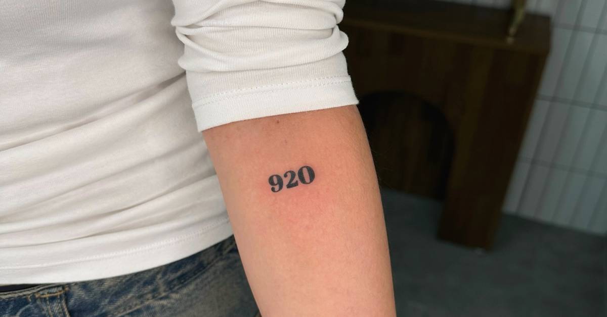 Hand poked "920" lettering tattoo located on the inner