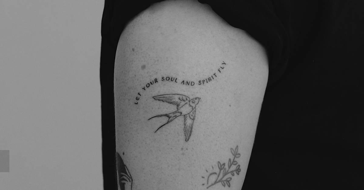 "Let your soul and spirit fly" and swallow tattoo