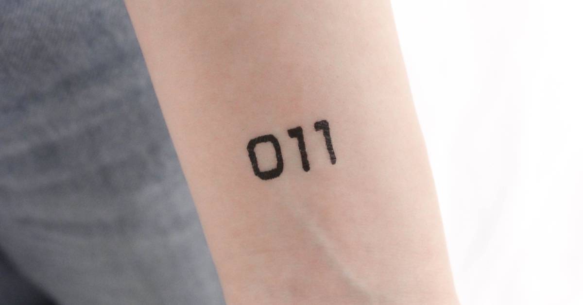 "011" Eleven temporary tattoo located on the wrist.