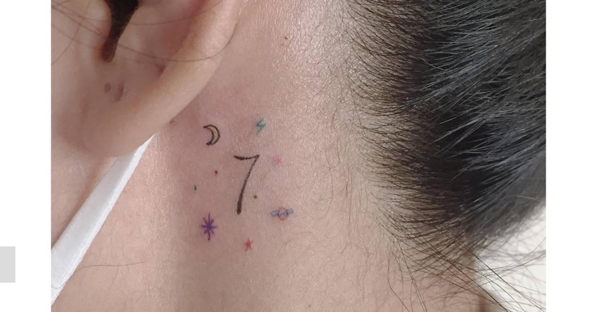 Number "7" and minimalistic universe tattoo located