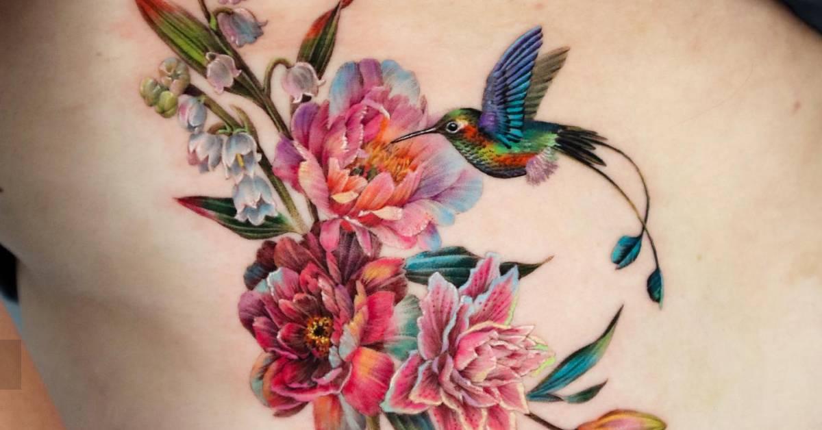 Long-tailed sylph and flower bouquet tattoo in