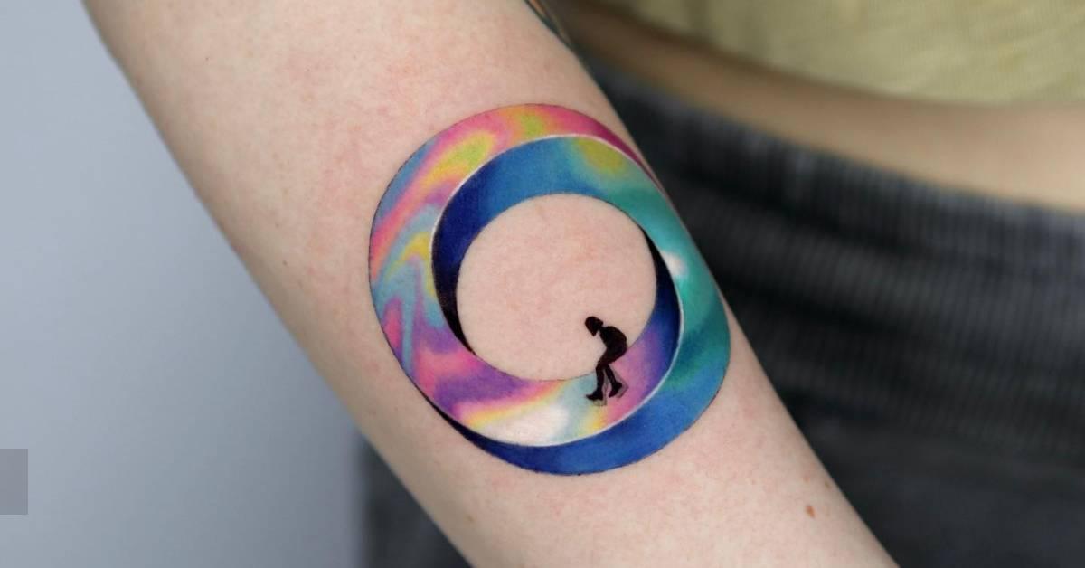 Holographic Mobius ring tattoo located on the forearm,
