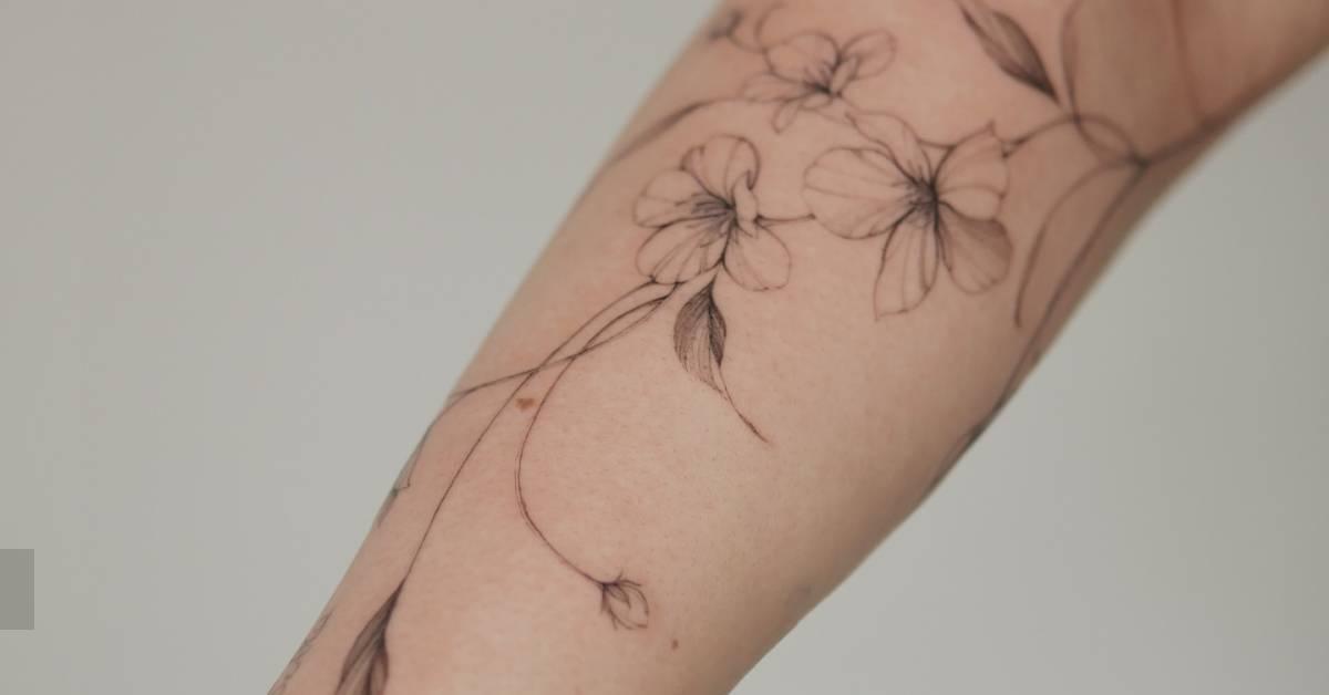 Illustrative style flowers tattoo placed on the