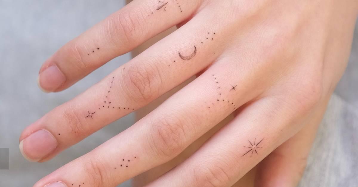 Single needle ornamental finger composition tattoos.