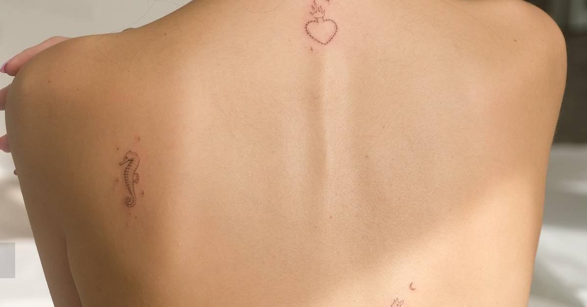 Single needle back composition tattoos.