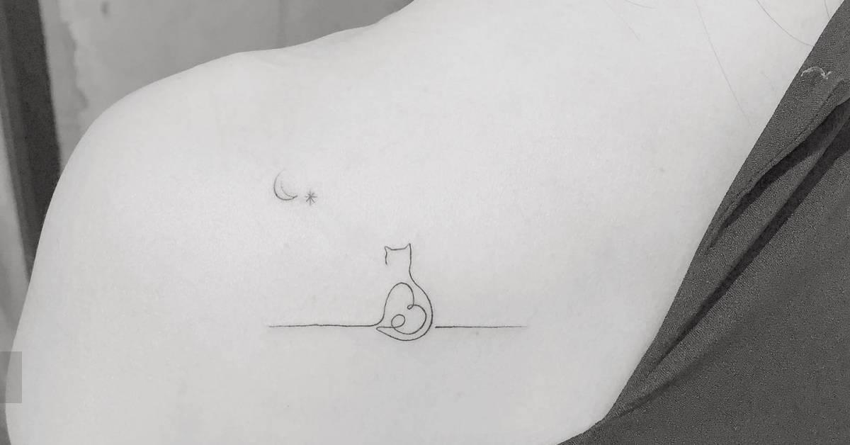 Continuous line cat and heart tattoo located on the