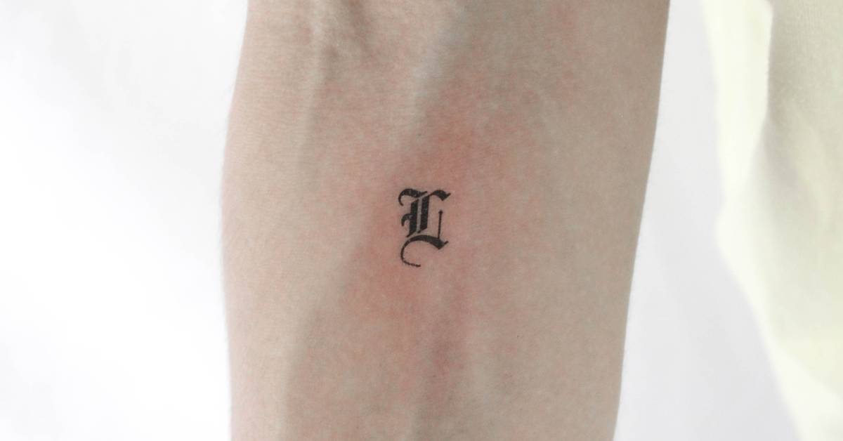 Gothic "L" letter temporary tattoo placed on the inner