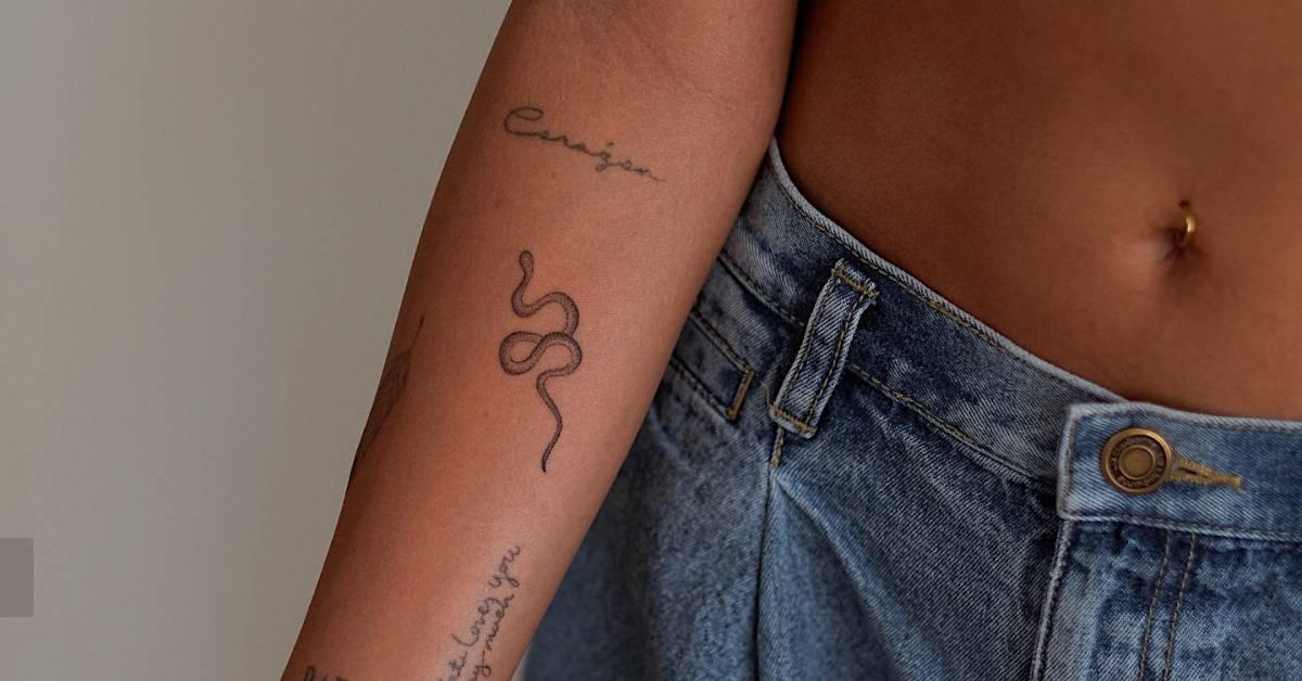 Arm composition tattoos.