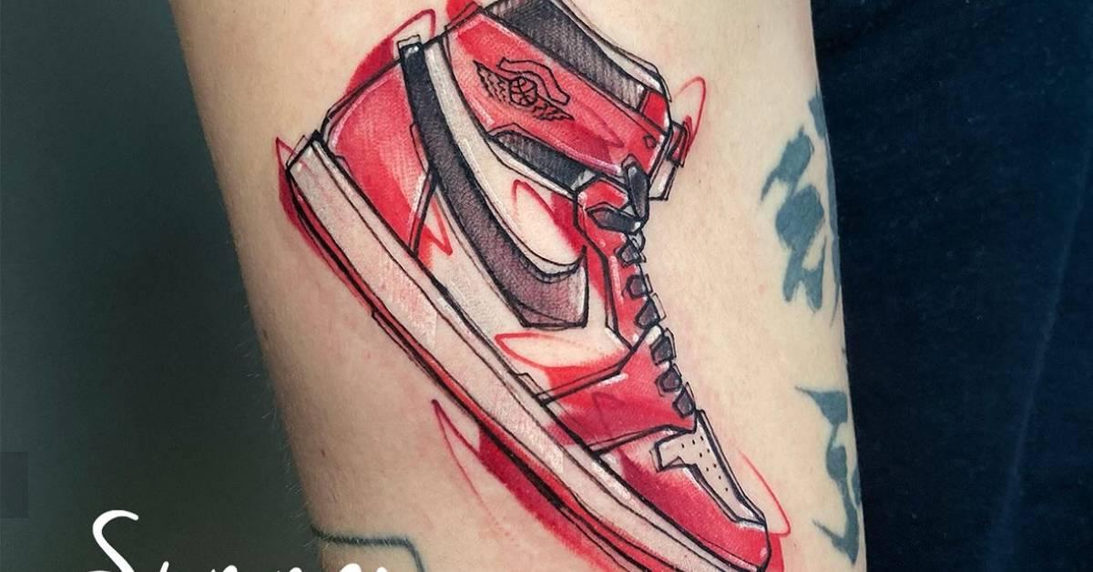 Nike Air Jordan 1 tattoo placed on the upper arm, done