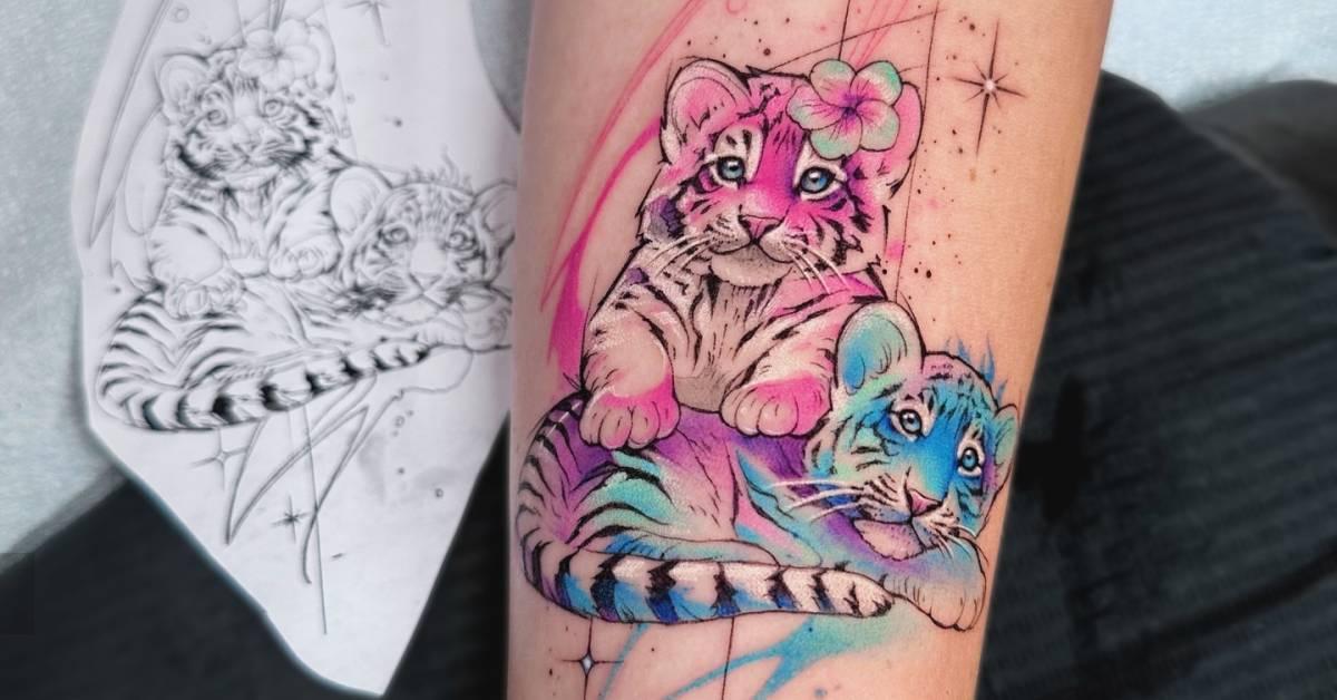 Watercolor style tiger cubs tattoo done on the inner