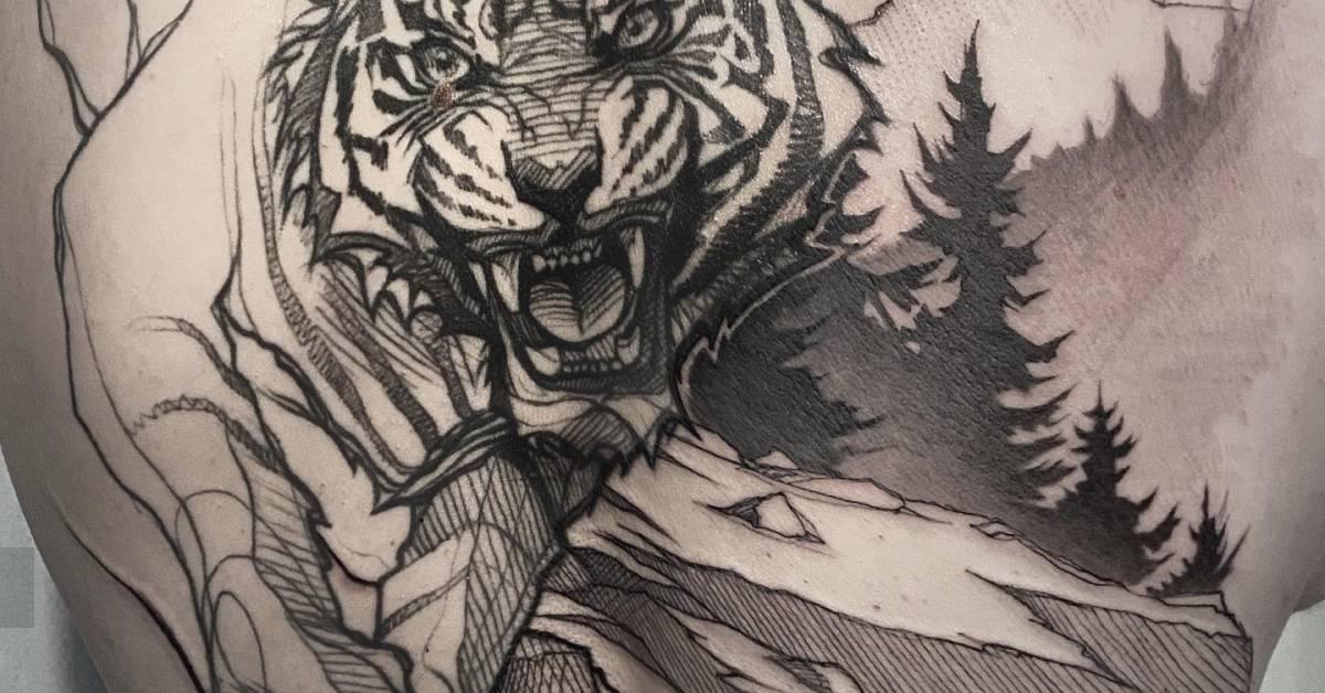 Huge tiger backpiece tattoo in sketch work style.