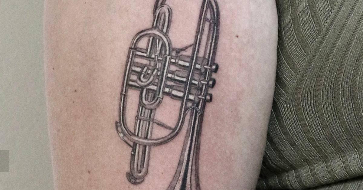 Single needle trumpet tattoo located on the upper arm.