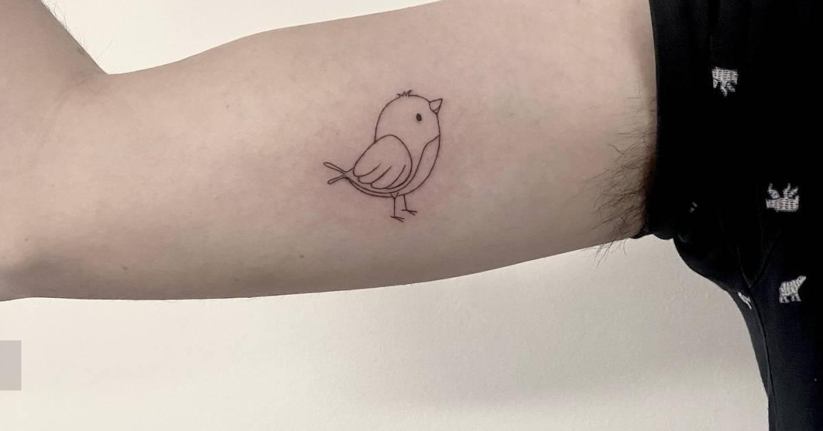 Little fine line style bird tattoo located on the inner