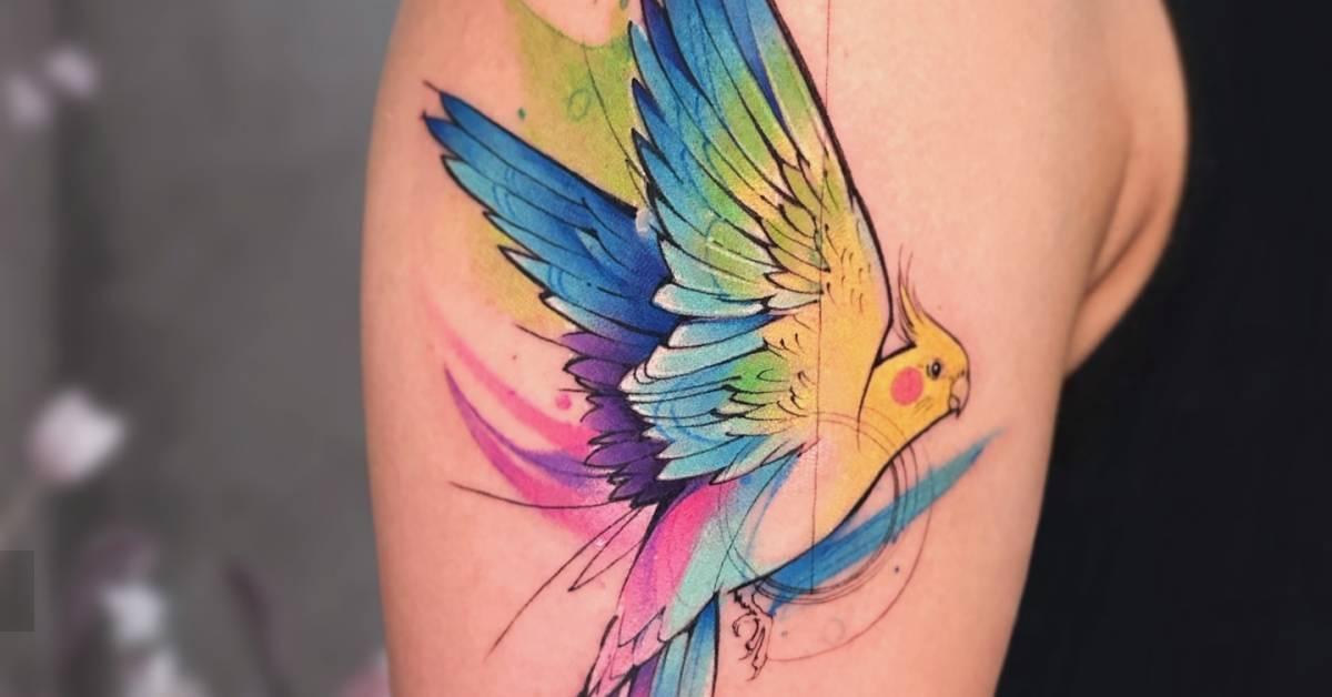 Cockatoo tattoo located on the upper arm, done in