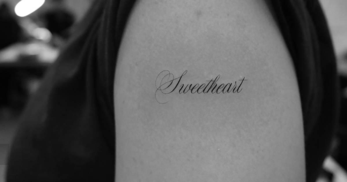 Lettering tattoo that says "sweetheart" located on the