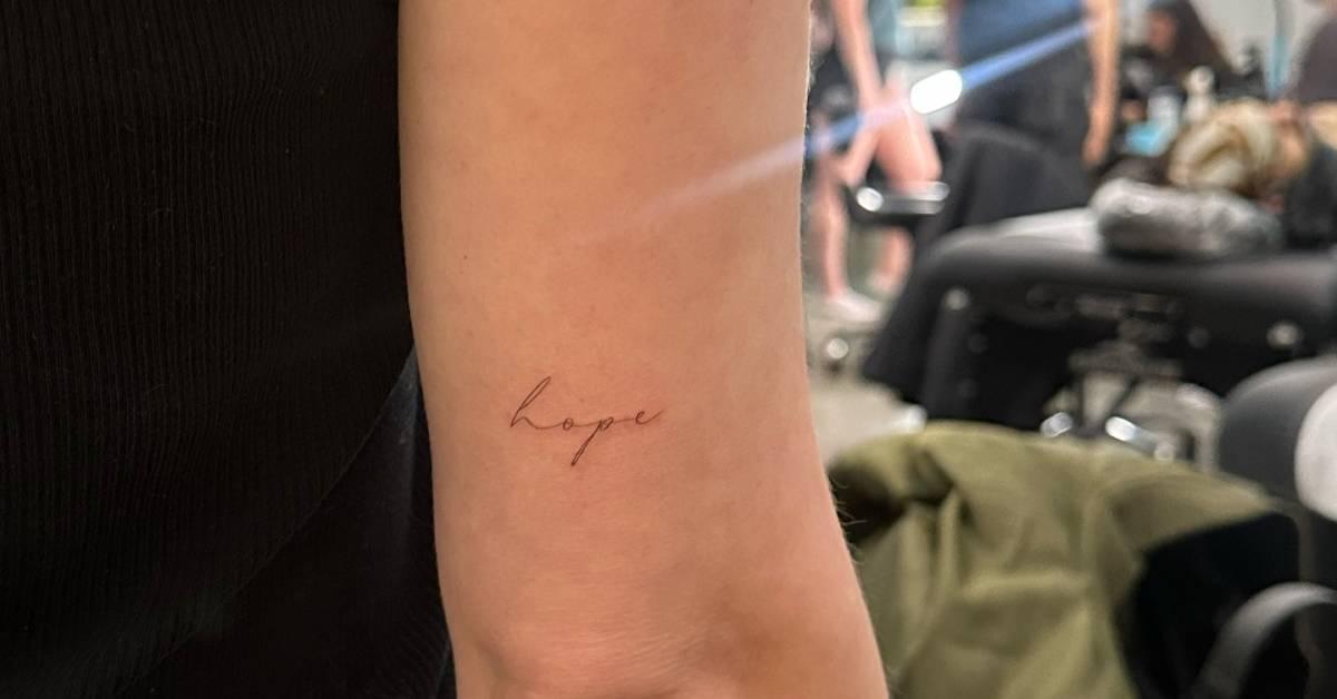 Lettering tattoo of the word "hope" placed on the