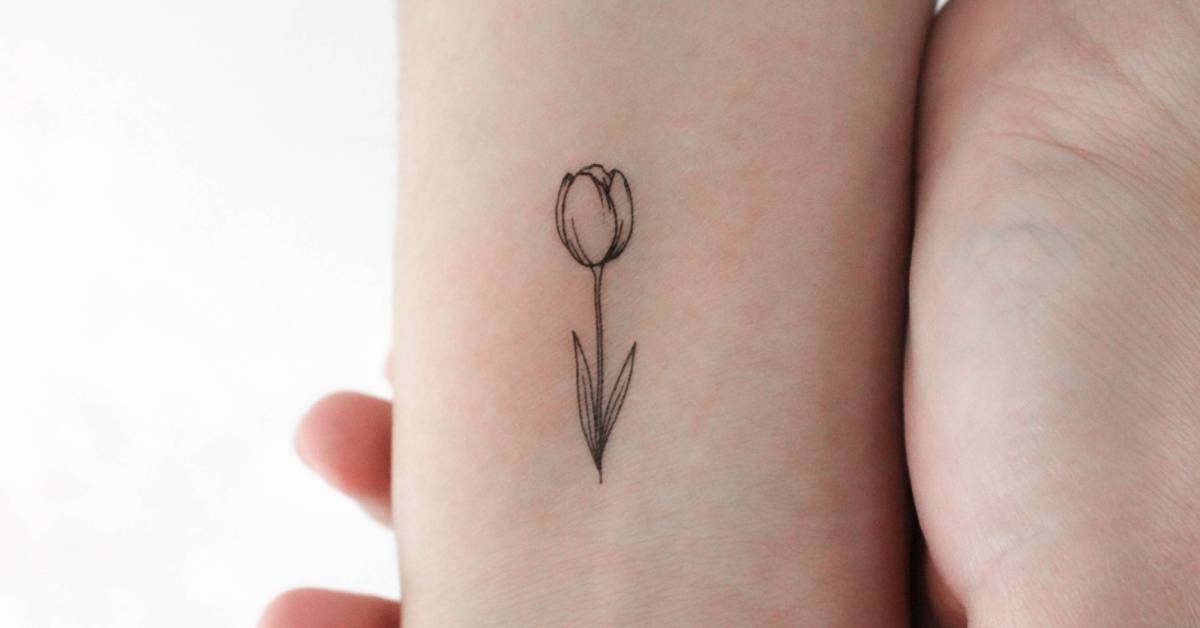 Fine line style tulip temporary tattoo located on the