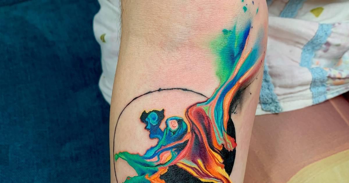Abstract style tattoo in watercolor style located on