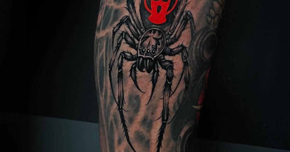 Spider tattoo in illustrative style located on the
