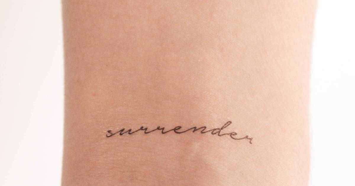 Handwritten font word "surrender" temporary tattoo