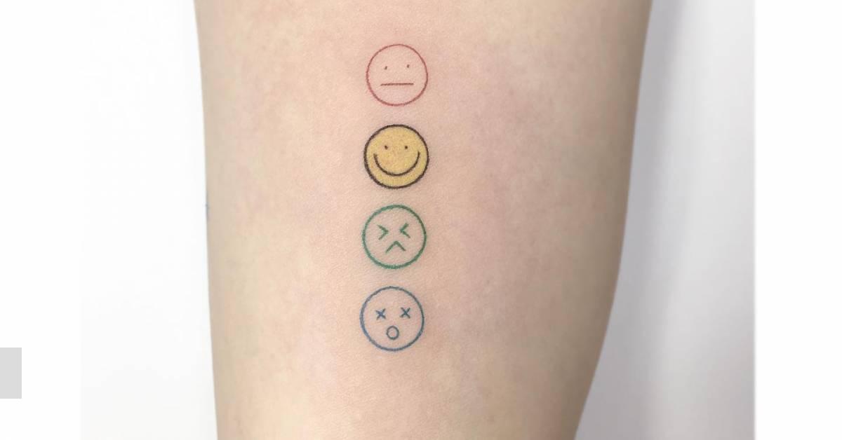 Minimalistic style emojis tattoo located on the inner