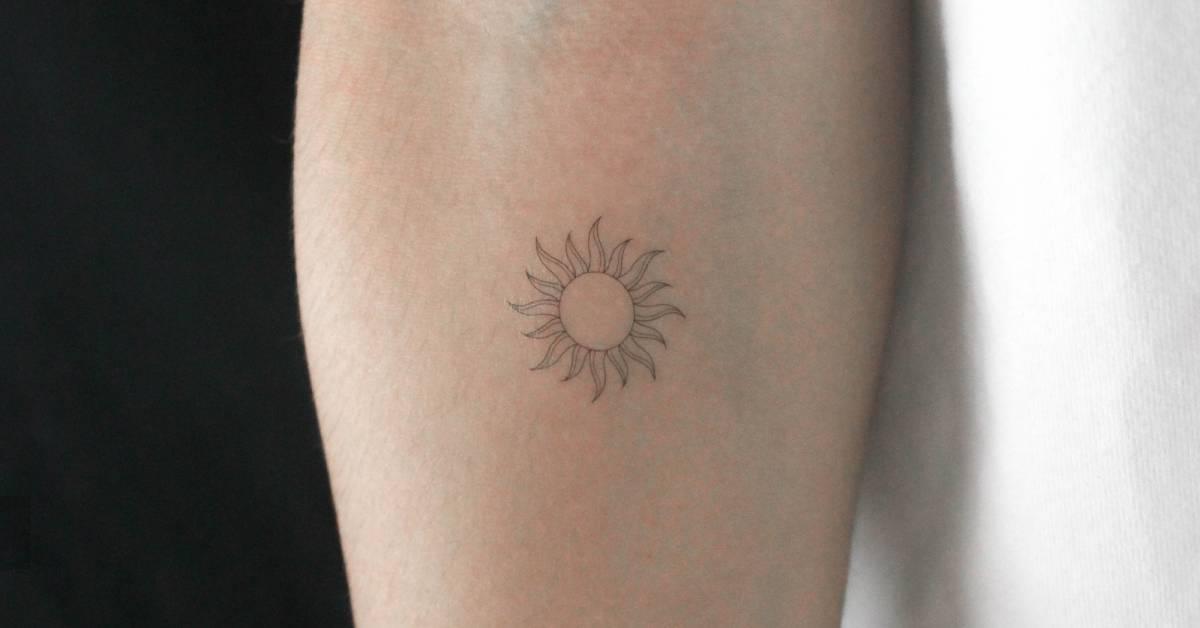 Fine line style small sun By 1991.ink temporary tattoo.