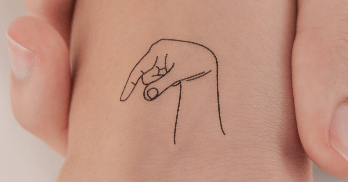 Sign language letter "Q" temporary tattoo located on