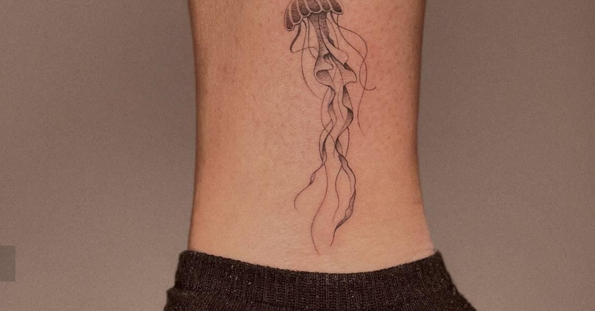 Jellyfish tattoo in illustrative style placed on the