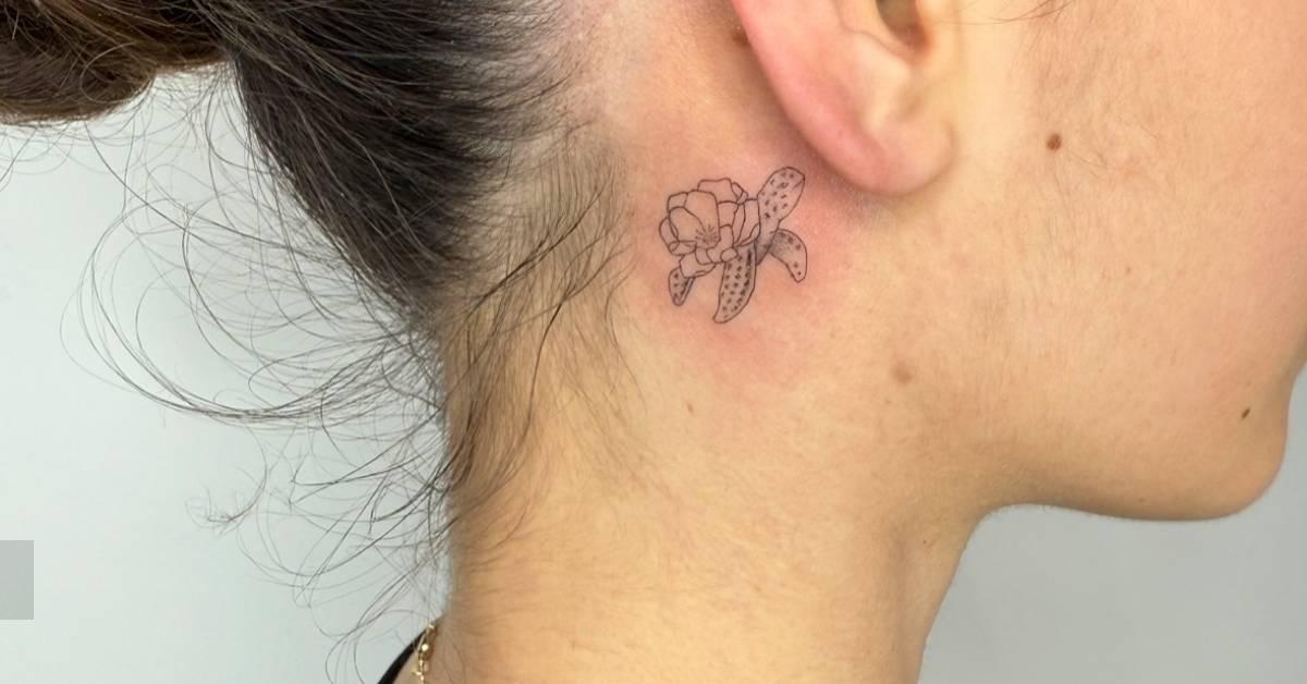 Flower turtle tattoo in fine line style done behind the