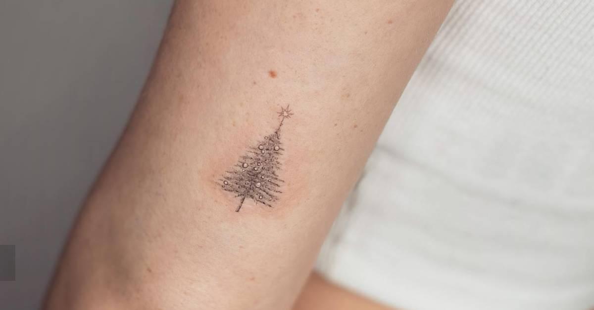 Micro-realistic style Christmas tree tattoo located on